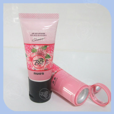 plastic cosmetic tube with mirror flip top cap