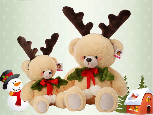 la peluche di seduta dell'orso polare della sciarpa gioca l'orso polare di Natale