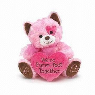 Orso della peluche che tiene un cuore, giocattolo del regalo del giorno di S. Valentino, fatto di peluche molle, disponibile in molti stili