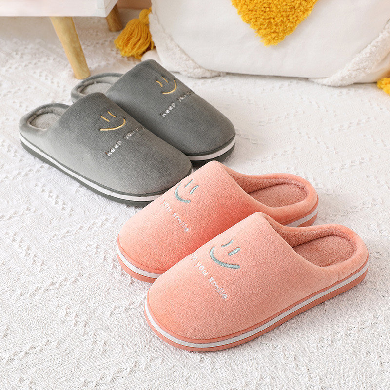Hot selling 2021 new fashion soft plush winter slippers smile patterns vamp non-slip couple home shoes in stock
