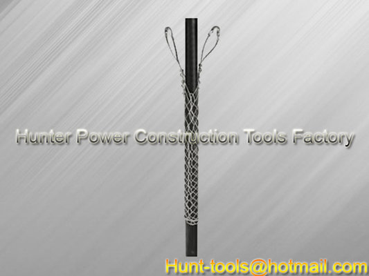 Hanger grip for electrical cable as it hangs in vertical, sloping