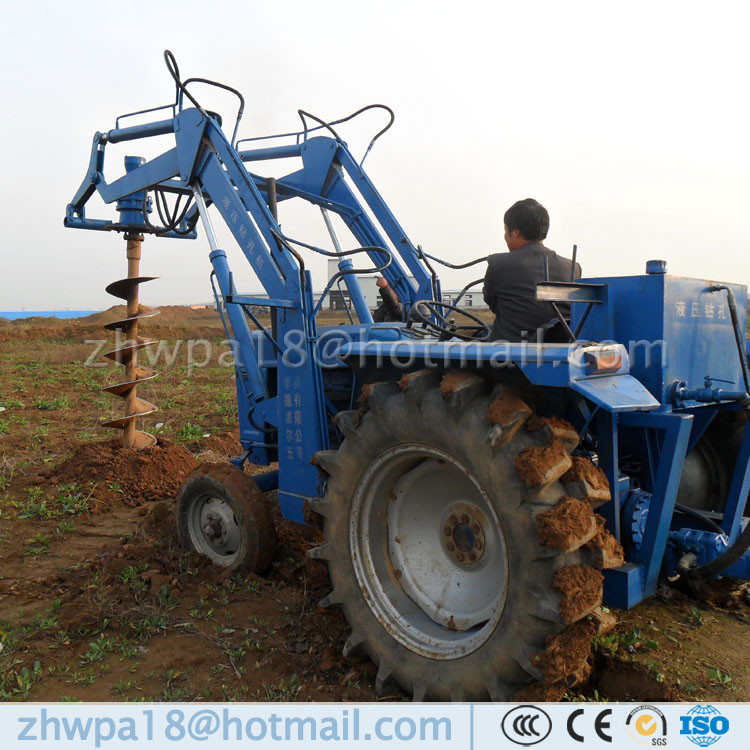 For making tree holes TRACTOR AUGERS BORE THROUGH