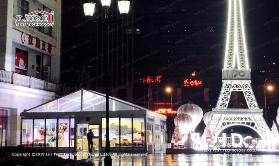 Transparent clear span event tent with glass walls and glass doors