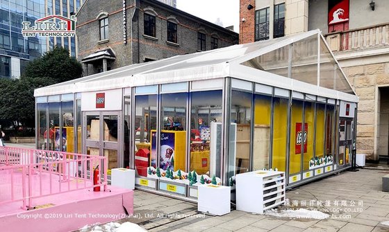 Transparent clear span event tent with glass walls and glass doors
