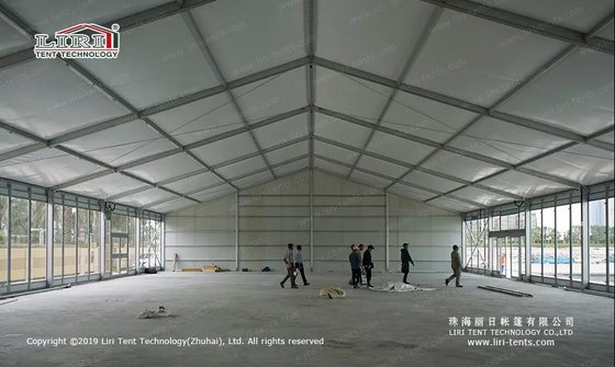 alluminum frame clear span tent with glass sidewalls and sandwich panel
