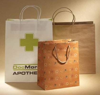 友好的なハンドル Eco が付いているブラウン多彩な印刷のクラフトの紙袋