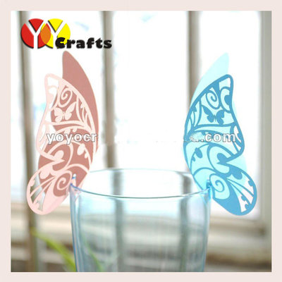 Paper butterfly wine glass place cards pink and light blue color for baptism ceremony